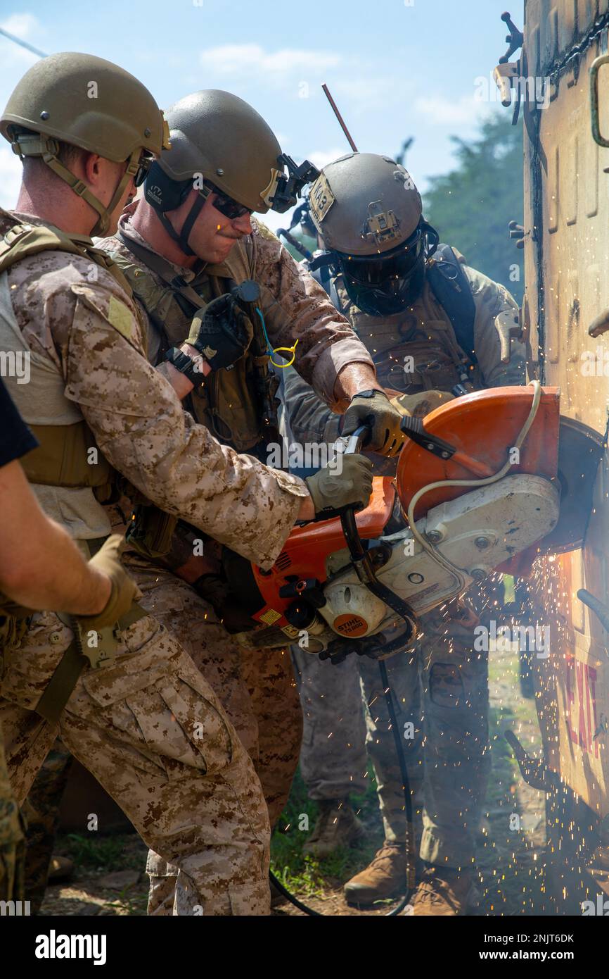 U.S. Marines and airmen attached to the Method of Entry School, Weapons ...