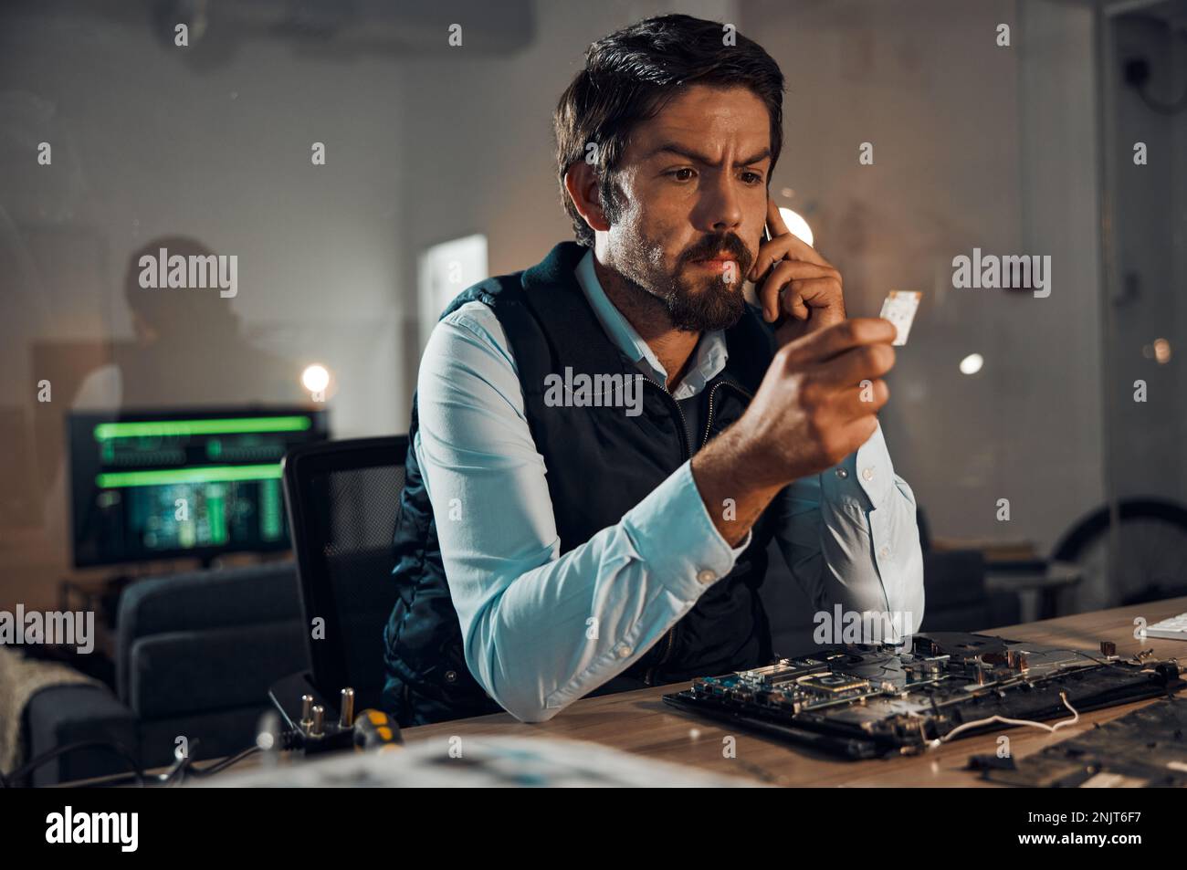 Computer hardware repair, microchip and serious it worker thinking how ...