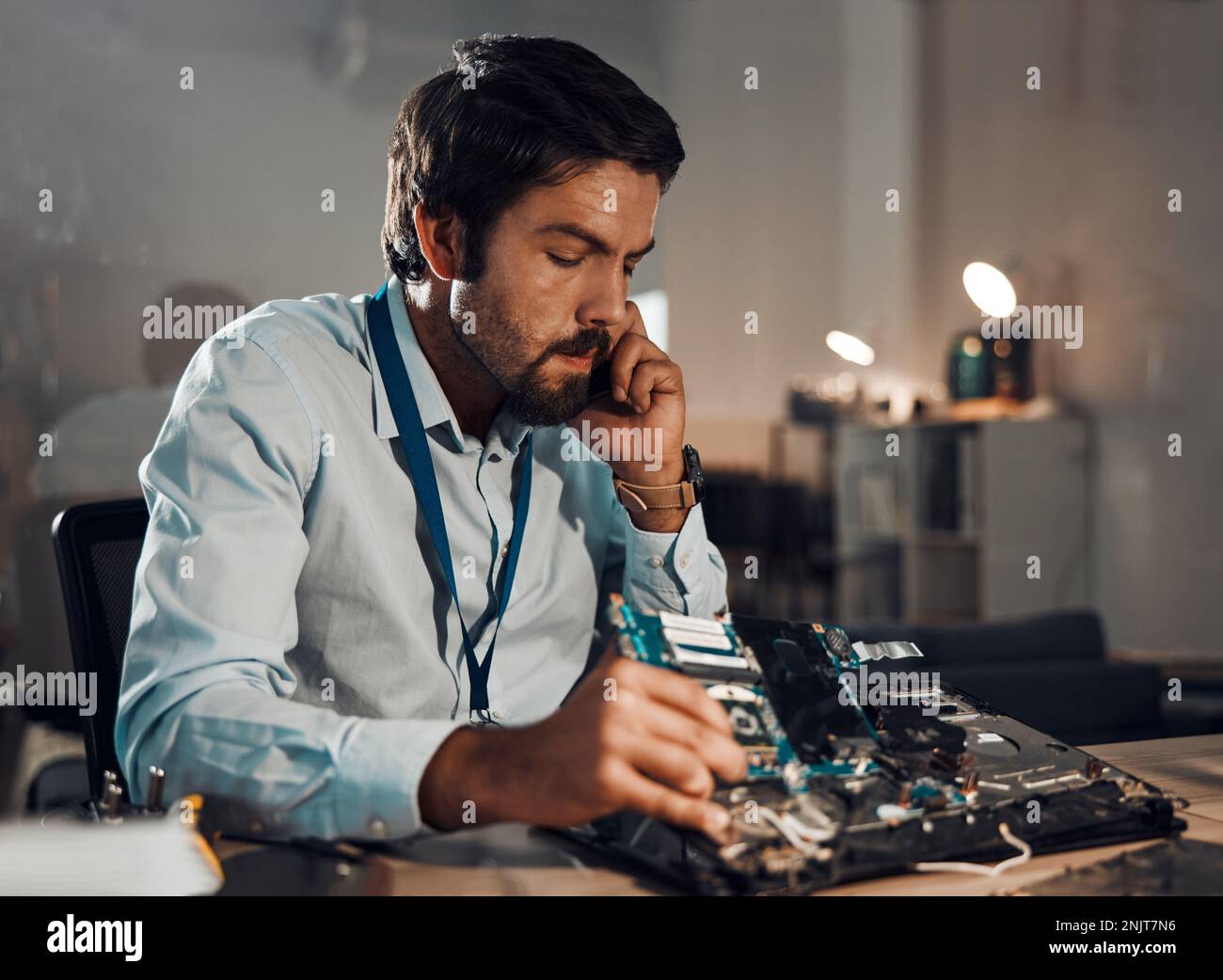 Technology, repair and thinking with an man fixing a device in an ...