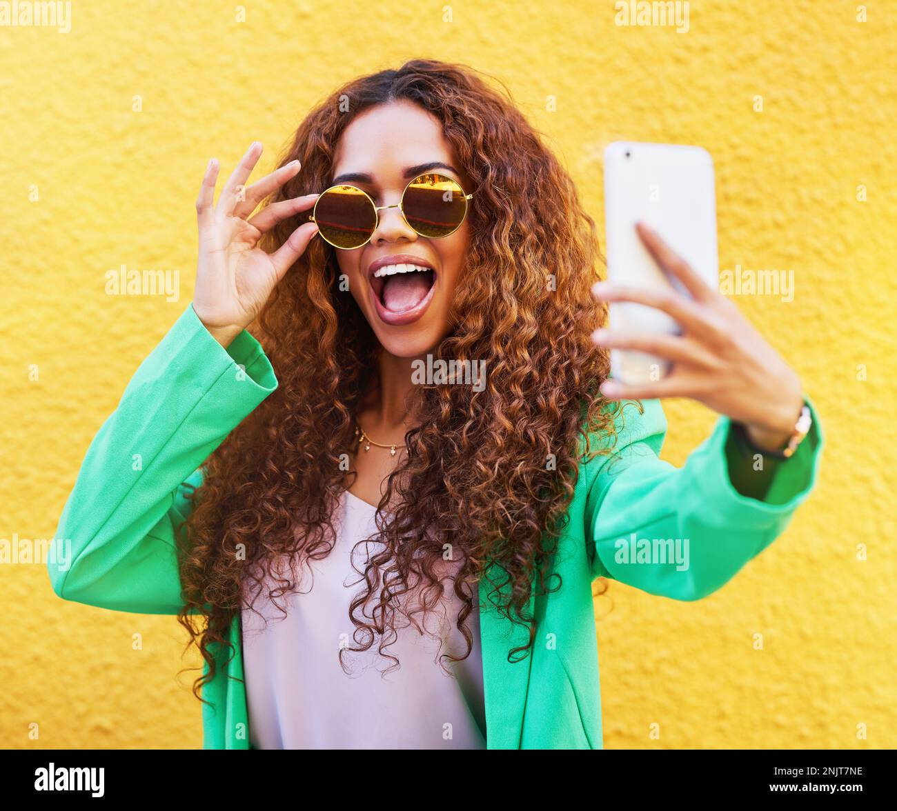 Selfie, fashion and woman with sunglasses on yellow background, color ...