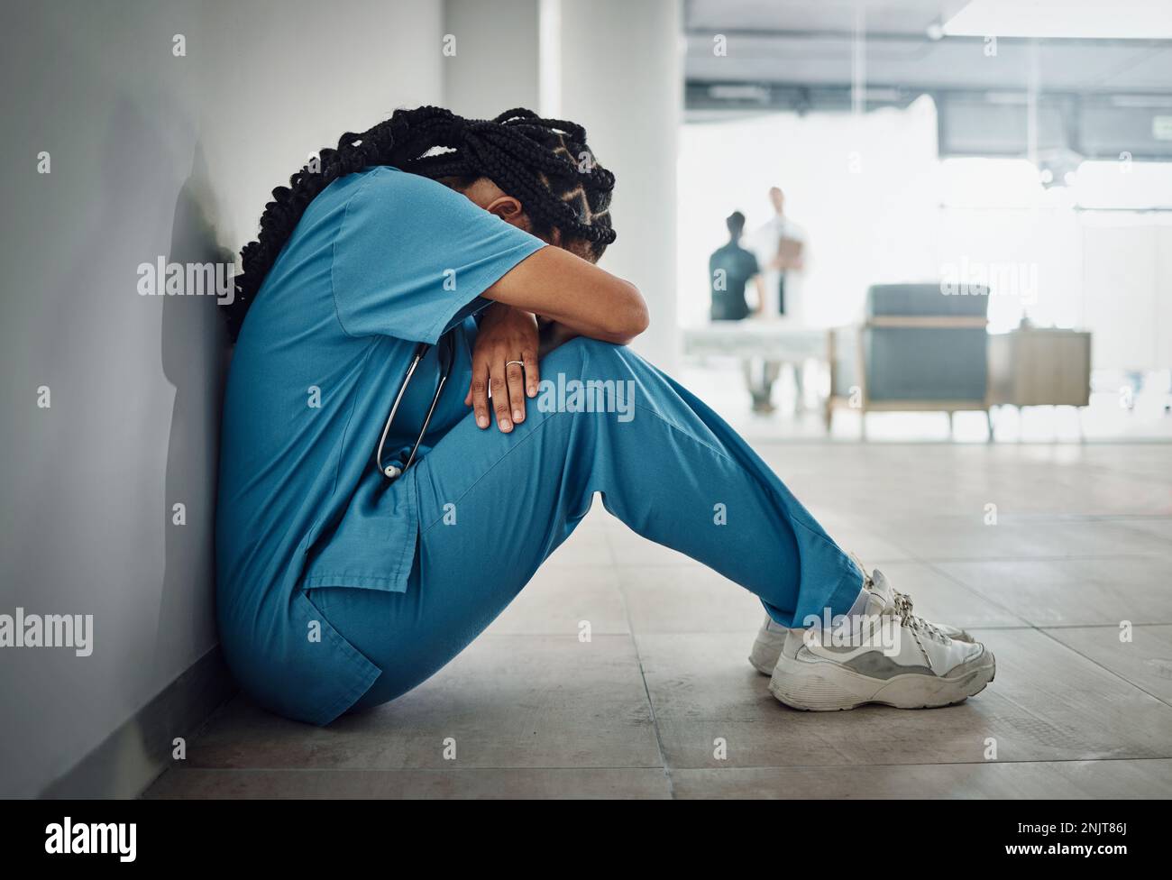 Doctor, depression and stress with black woman on floor for patient ...