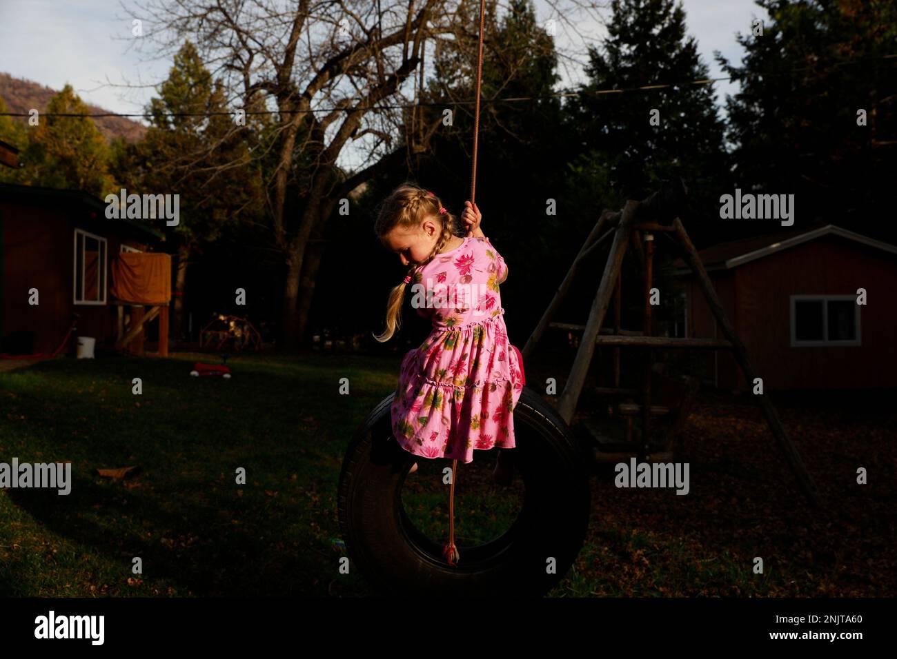 Maleah Varney, 5, swings on a tire swing outside of her house in ...