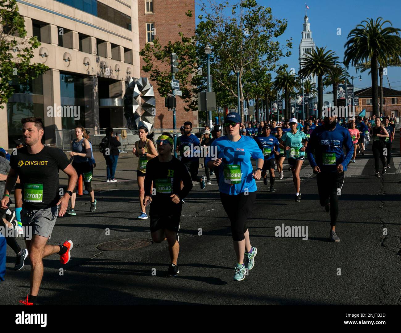 Runners in the 5k take off from the start line on the Embarcadero near ...