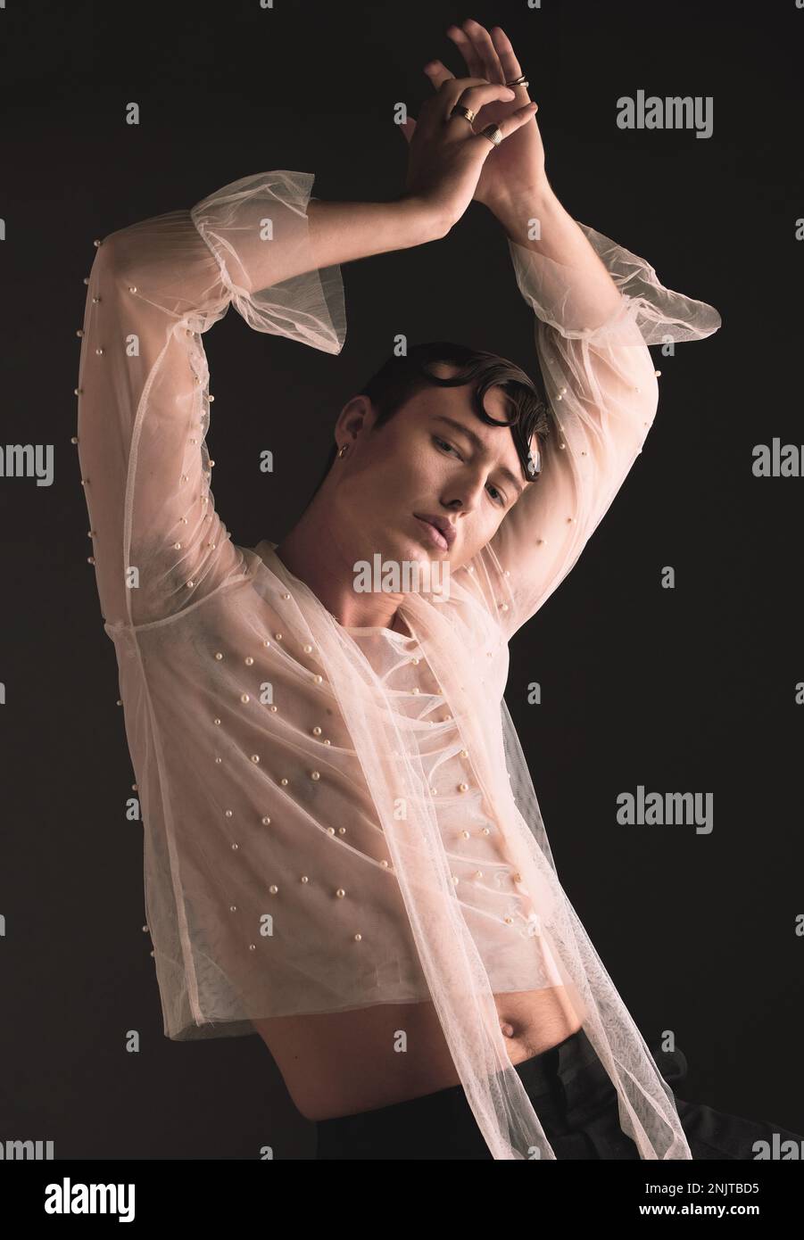 Gender neutral, portrait and gen z fashion with designer clothing and ...