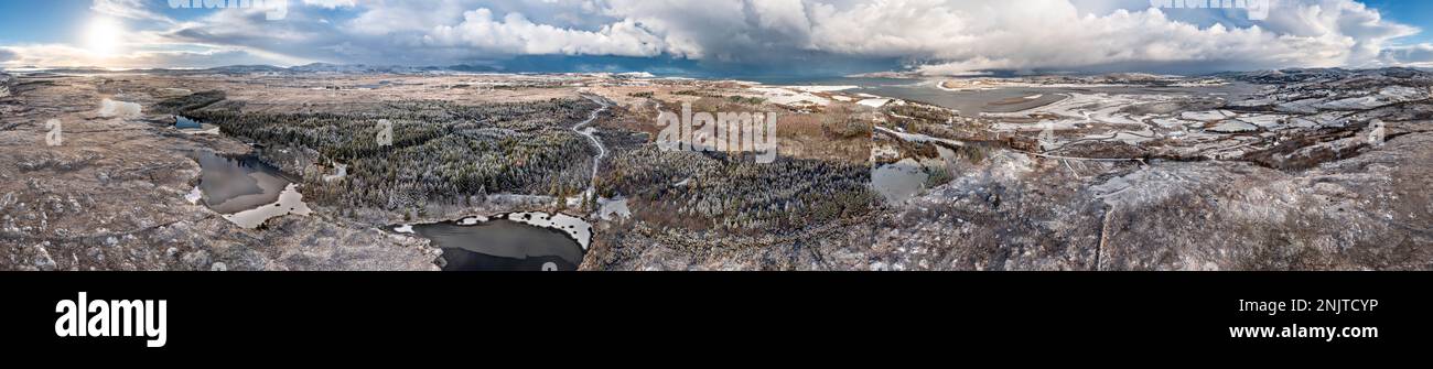 Aerial view of snow covered Bonny Glen Woods by Portnoo in County ...