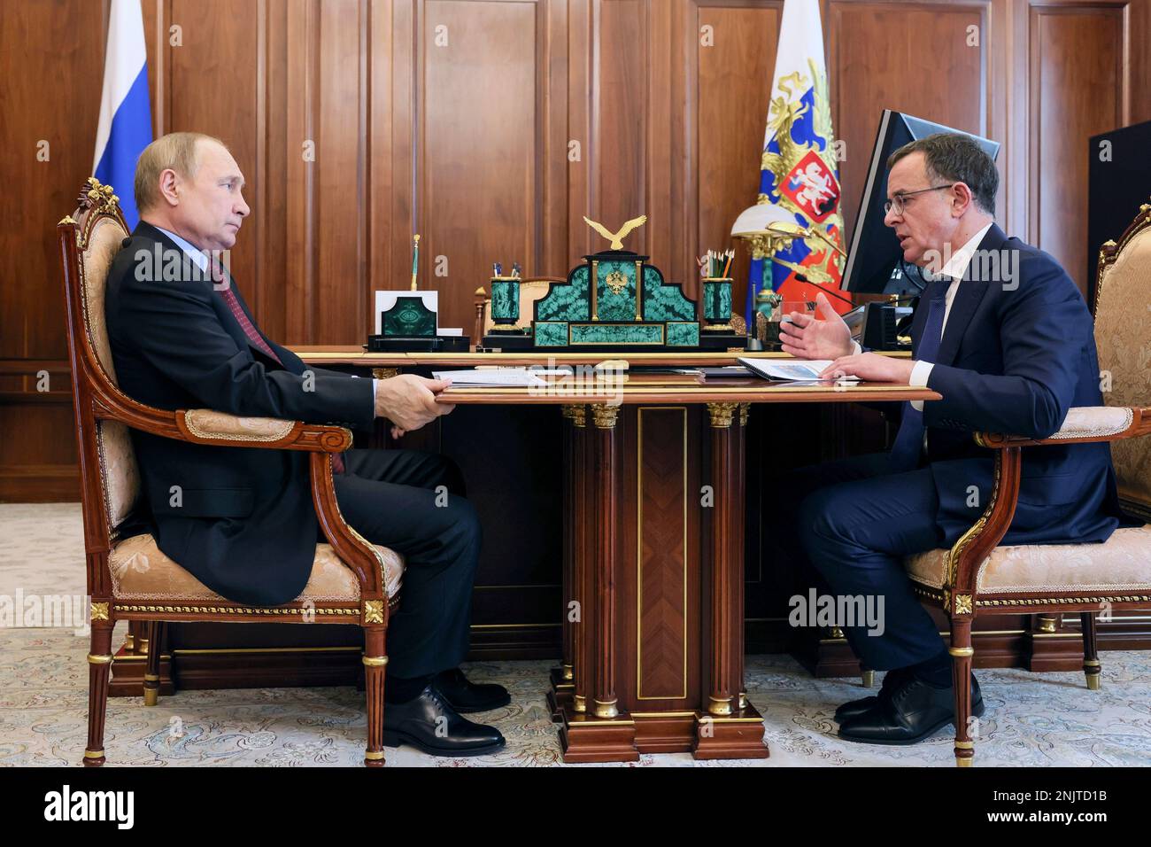 Russian President Vladimir Putin listens to Director General of the ...