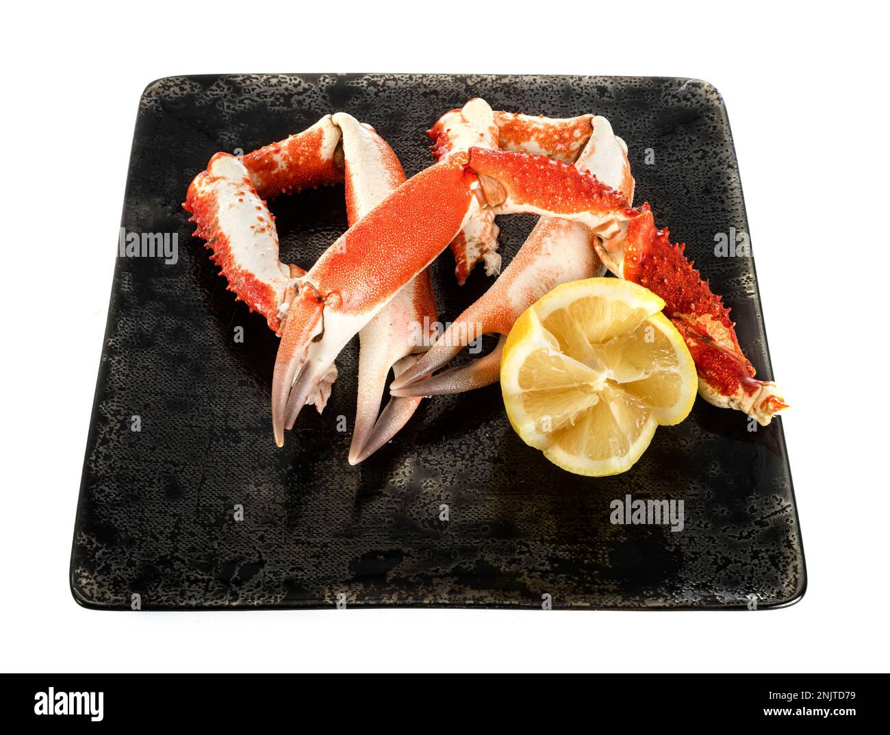 king crab leg in front of white background Stock Photo - Alamy
