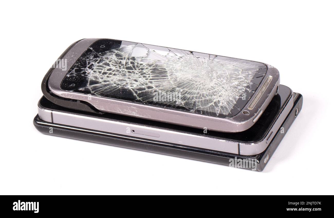 Broken display screen smartphone (stack) on a white background Stock ...