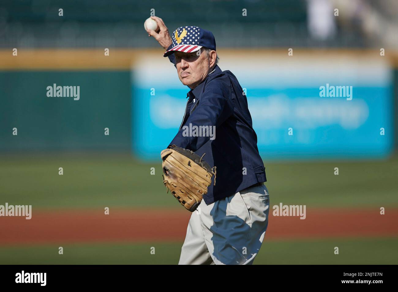 Colonel James Quincy Collins Jr. prepares to throw out the ceremonial ...