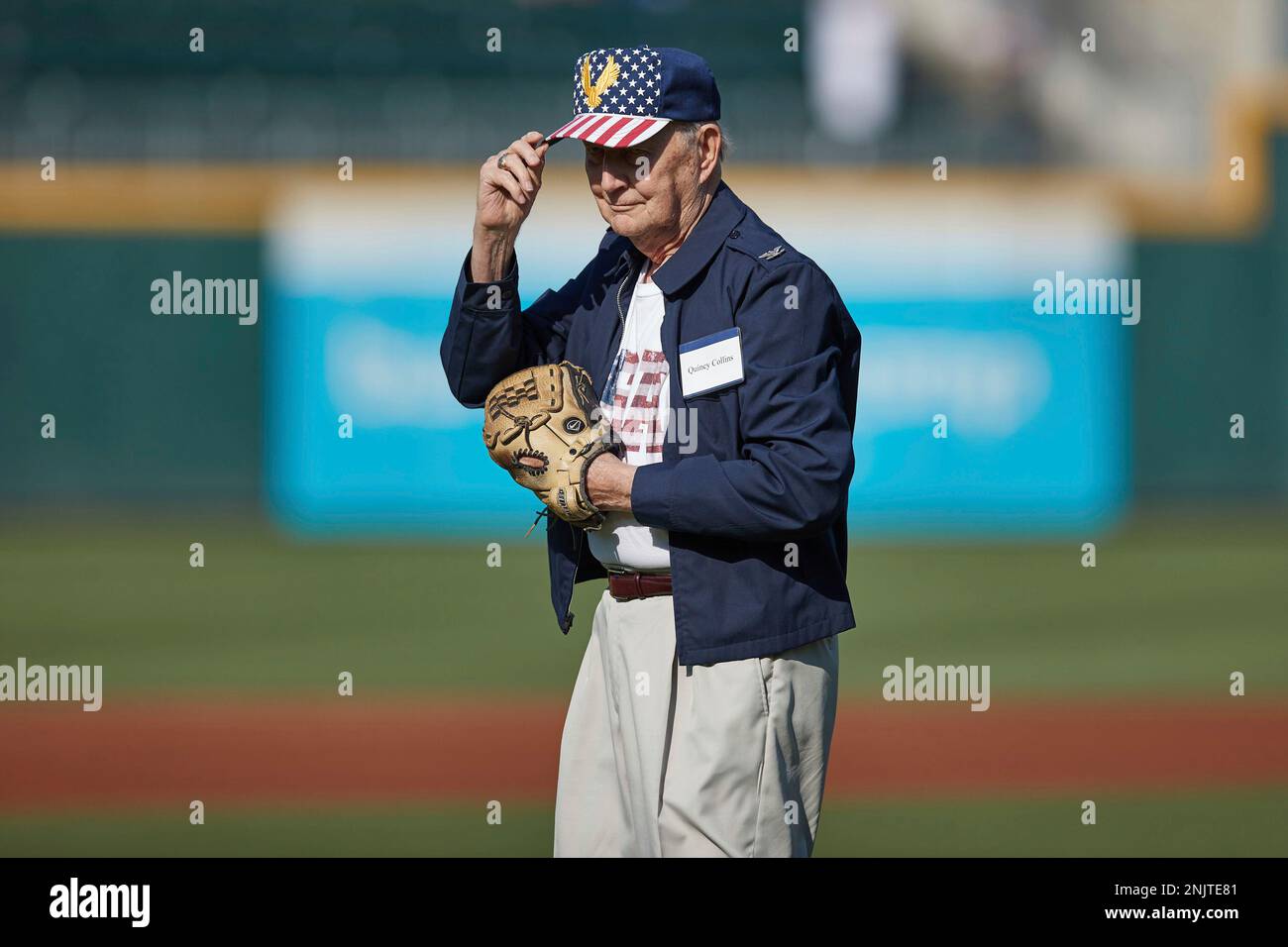 Colonel James Quincy Collins Jr. prepares to throw out the ceremonial ...