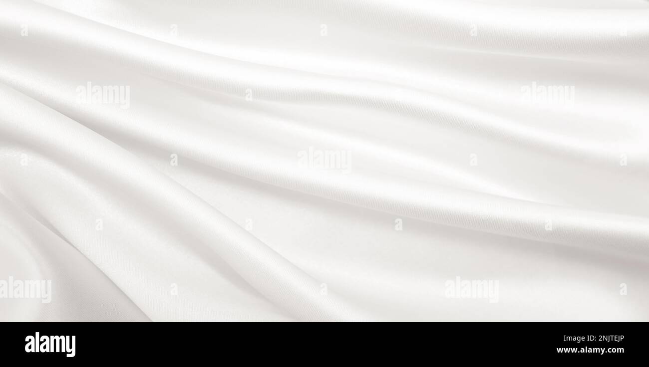 Smooth elegant golden silk or satin luxury cloth texture can use as ...