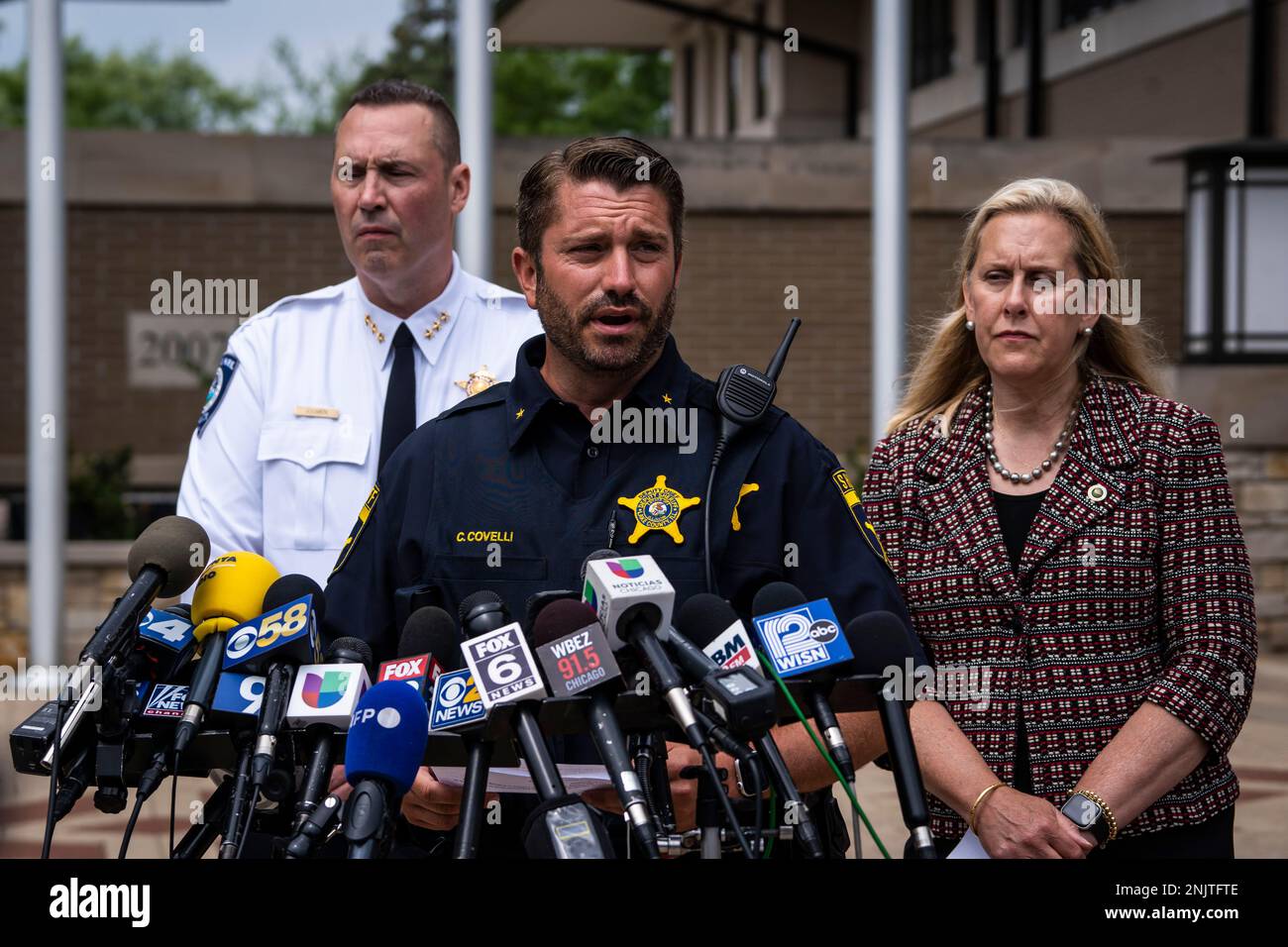 Highland Park Police Chief Louis Jogmen and Mayor Nancy Rotering look ...