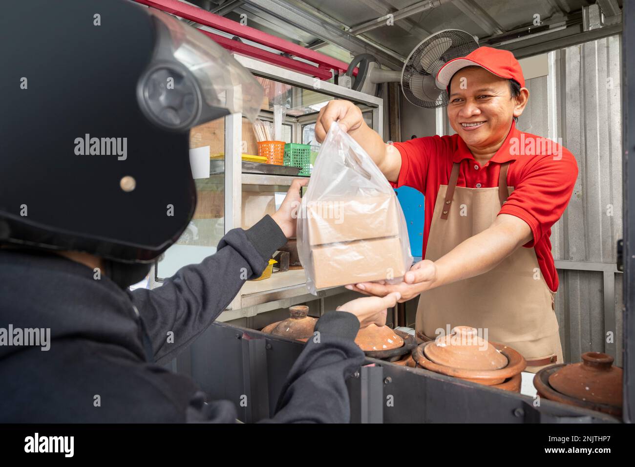 Male receiving order hi-res stock photography and images - Alamy