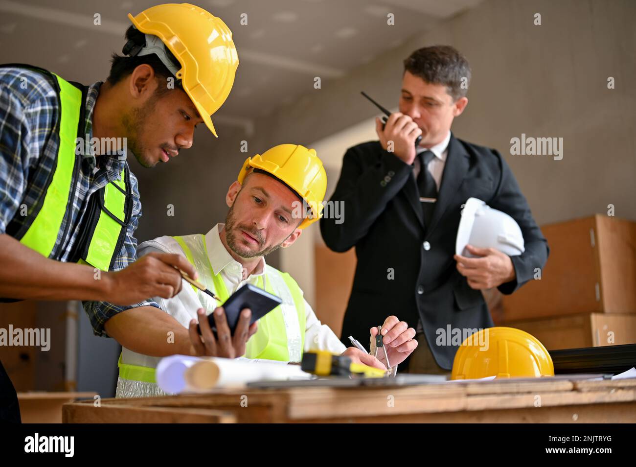 Team of construction engineer and businessman working together in the ...