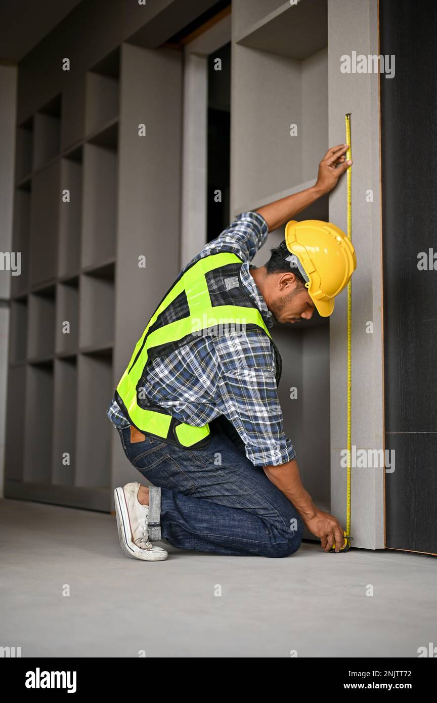 Portrait, Professional Asian male construction inspector using a ...
