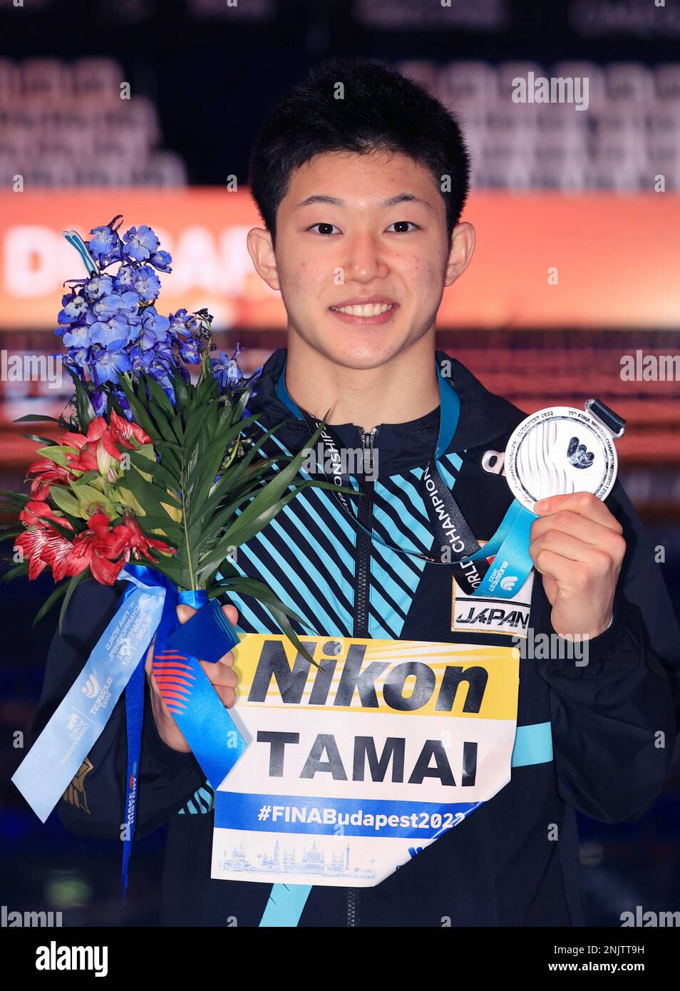 Rikuto Tamai of Japan shows his silver medal during diving men 10m ...