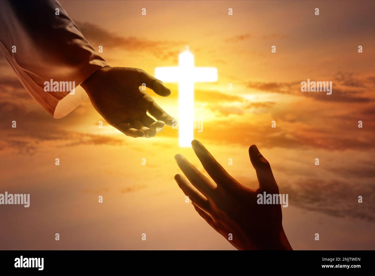 Jesus Christ giving a helping hand to humans with dramatic sky ...