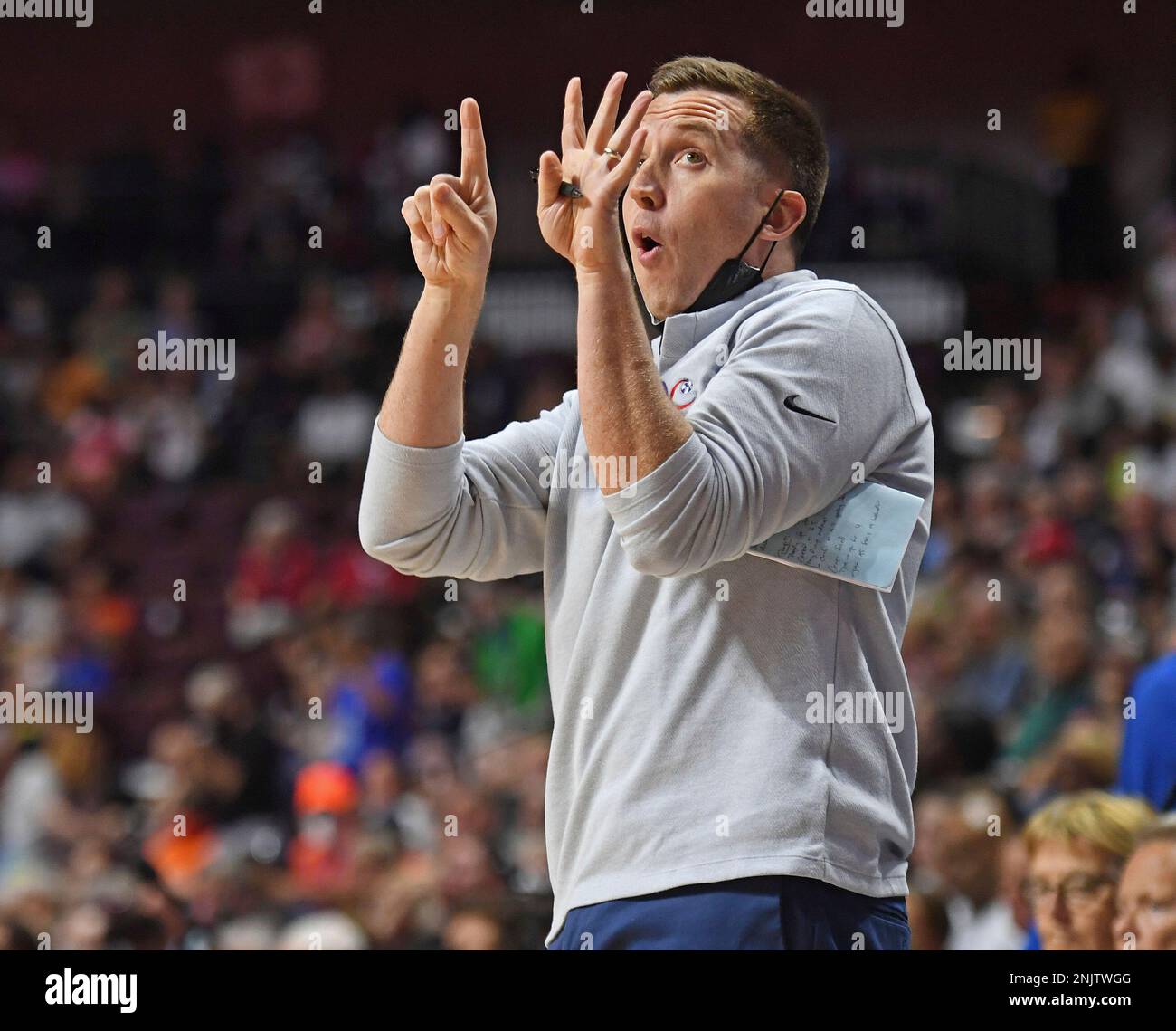 Washington Mystics assistant coach Eric Thibault calls a play in to the ...