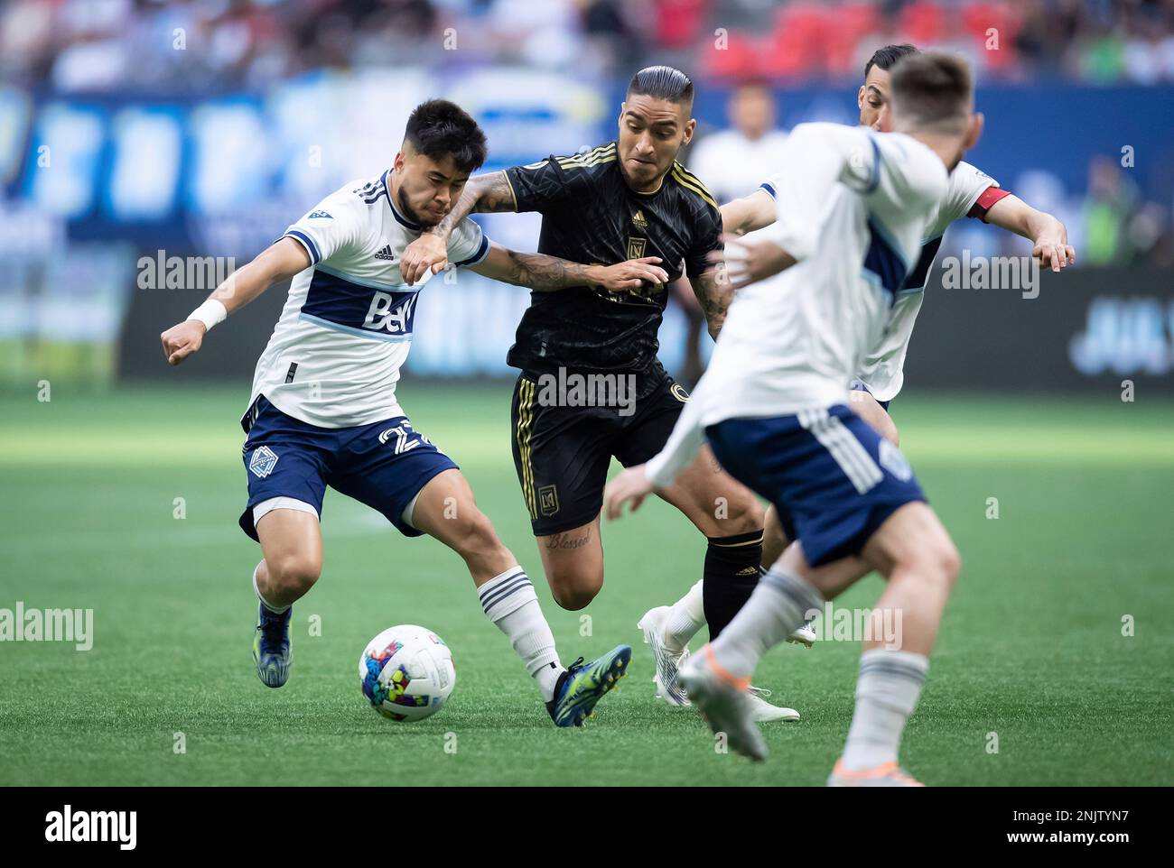 Vancouver Whitecaps' Ryan Raposo, left, and Los Angeles FC's Cristian ...