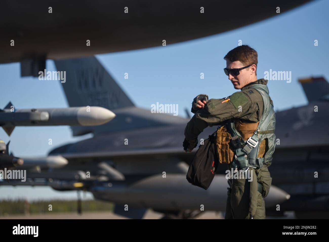 U.S. Air Force Capt. Luke Scott, 13th Fighter Squadron pilot, stands on ...