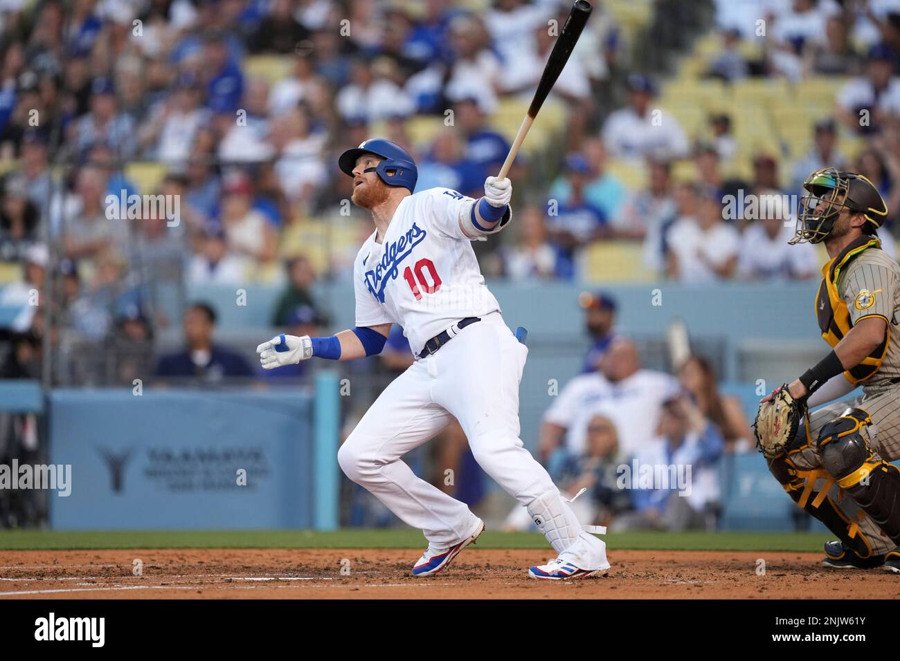 Los Angeles Dodgers third baseman Justin Turner (10) follows through on ...