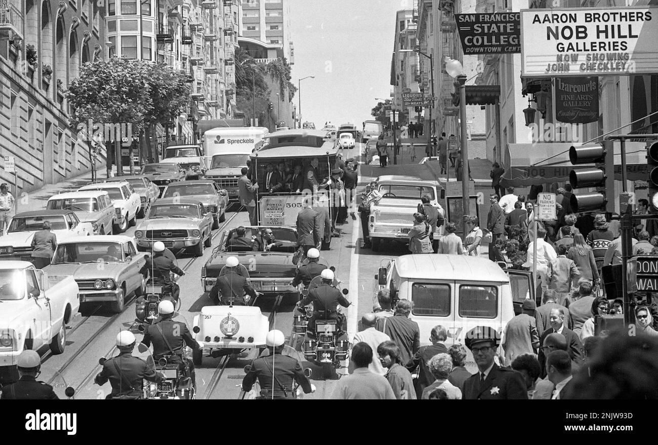 July 23, 1969. Police and secret service follow behind President ...