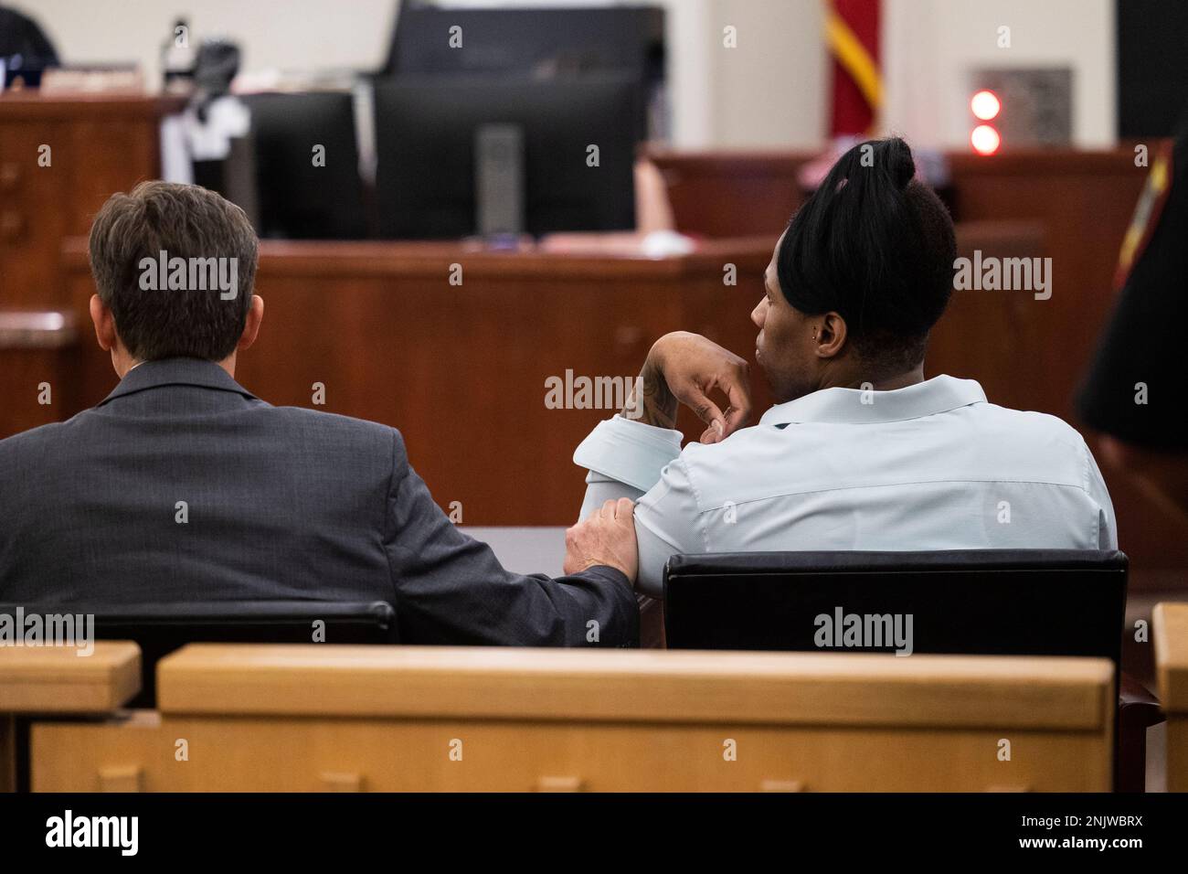 Attorney Patrick Curran touches Timothy Huff's arm as his sentence is read, Wednesday, June 29 ...
