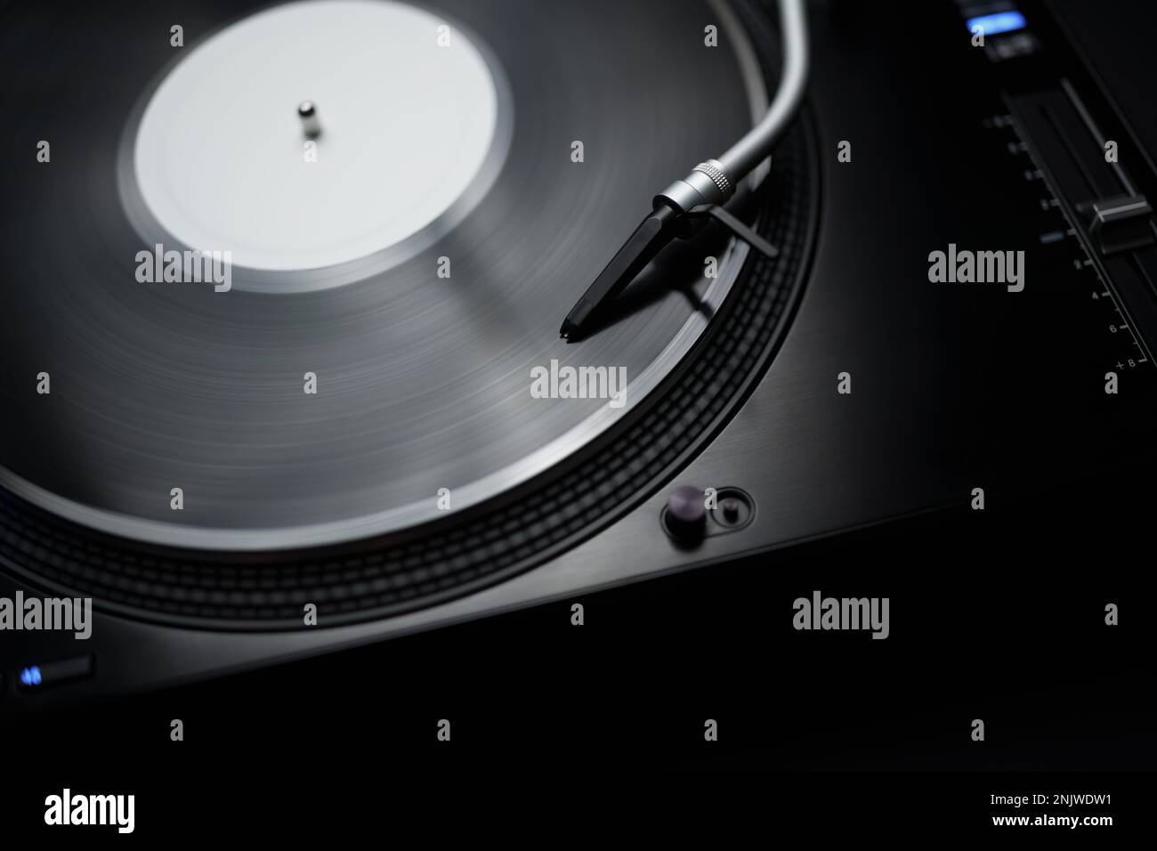 Listen to music with hi fi turntable player and vinyl record. DJ turn ...