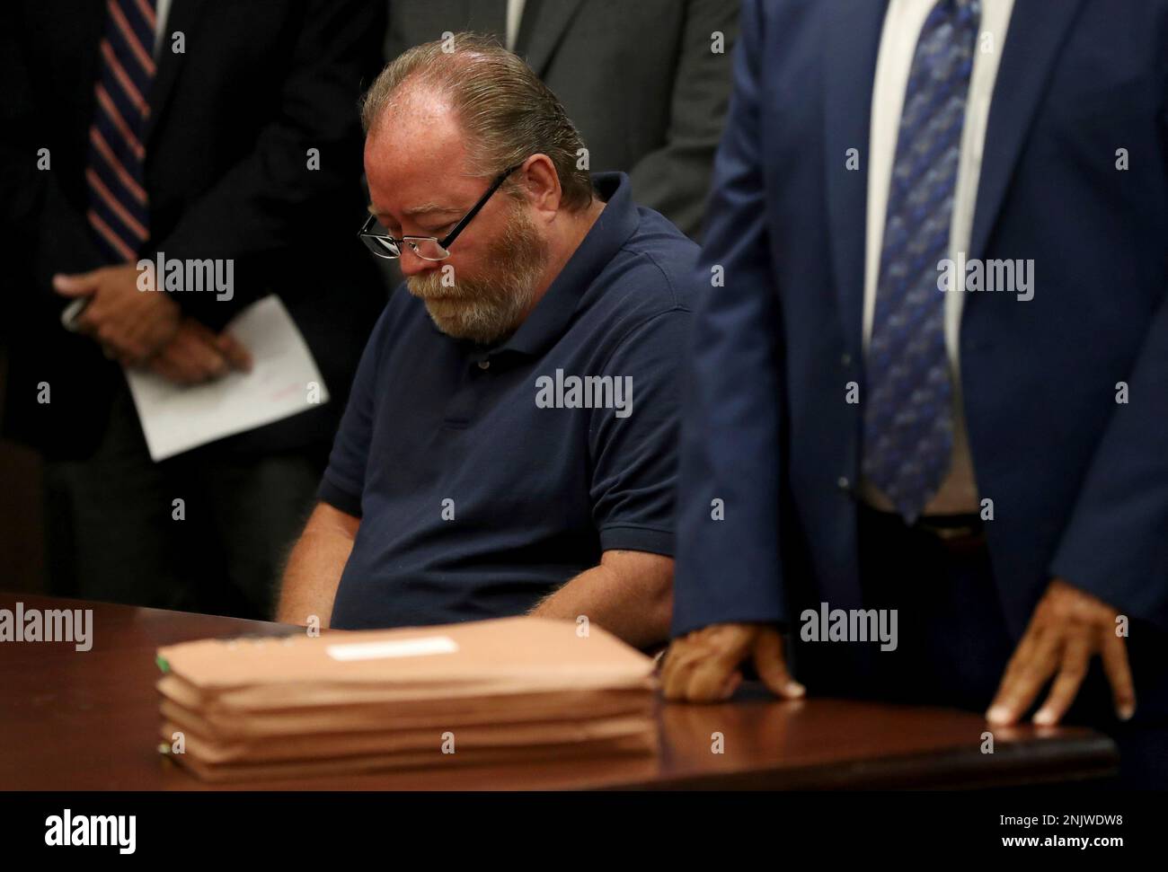 William Reece sits in 405th District Court Judge Jared Robinson's ...