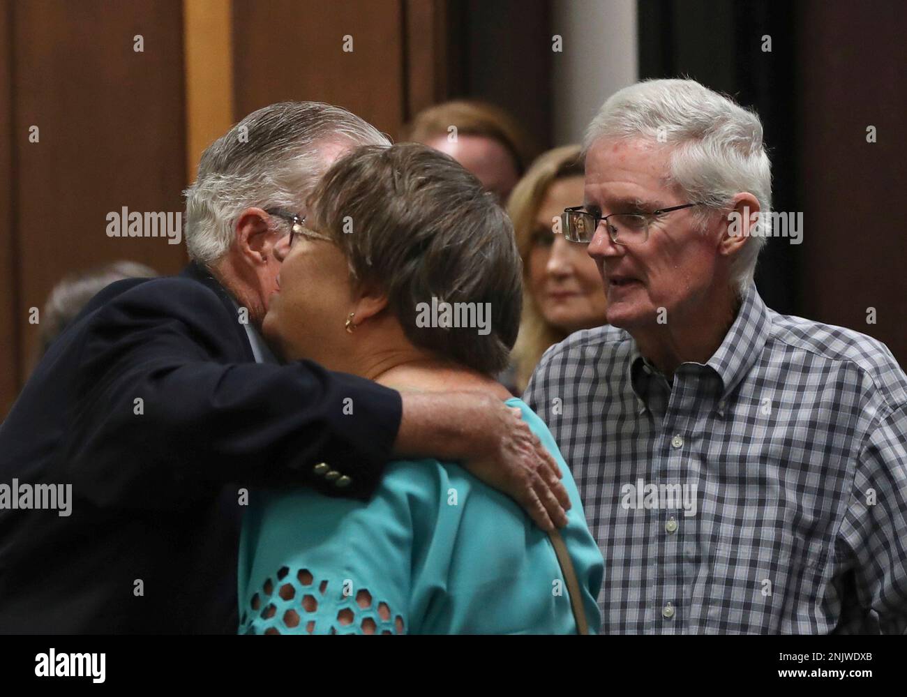 Gay Smither receives a hug from Galveston County Sheriff's Office Lt ...