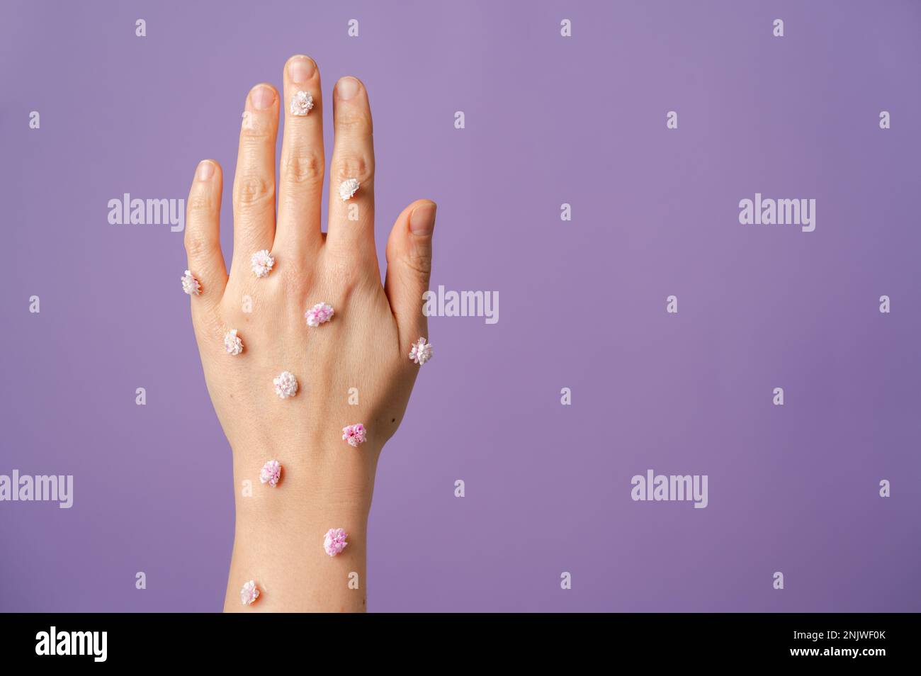 Left hand raised gesture on purple. Left hander day concept. Small ...