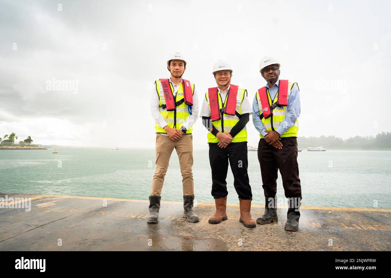 Surbana Jurong director of reclamation Chia Way Seng (centre) with ...