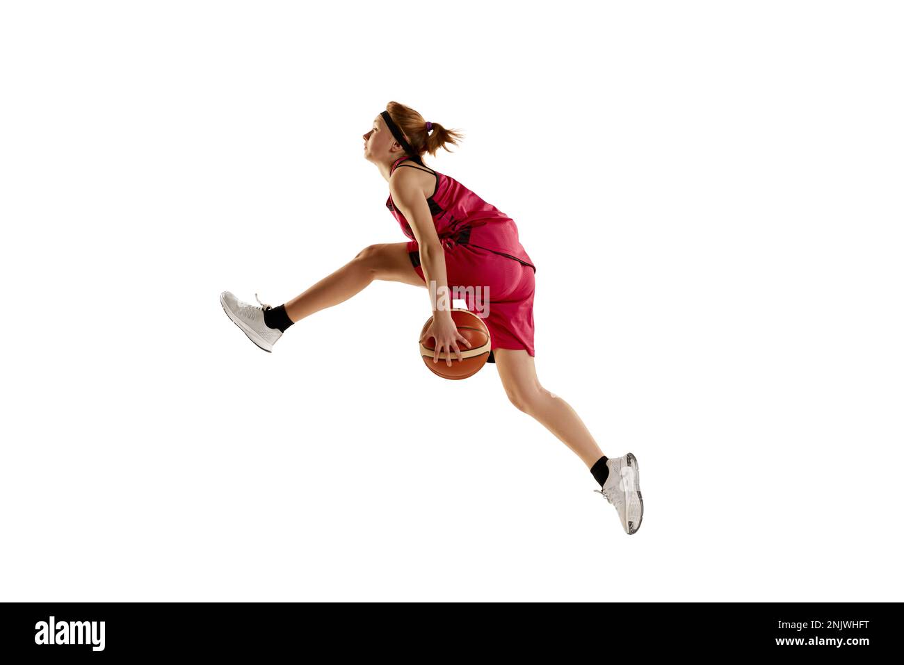 Side view. Dynamic portrait of teen girl, basketball player in motion ...