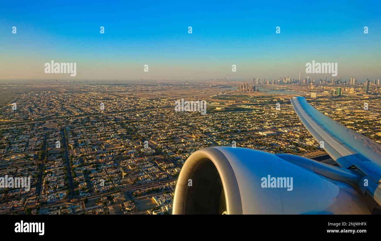 Aerial view of Dubai from the plane. Blue sky and golden city. Photos ...