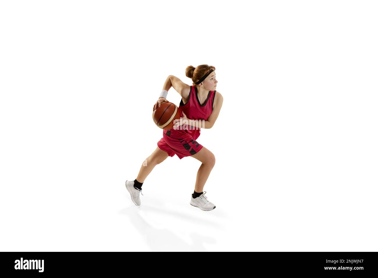 Concentrated active teen girl, basketball player in motion, playing ...
