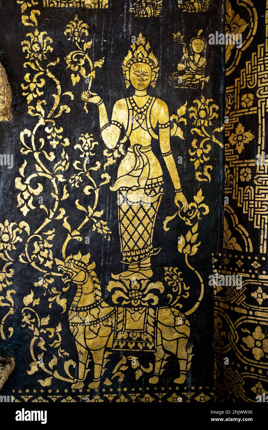 Laos: Gold stencilled paintings on the inner wall of the Sim ...