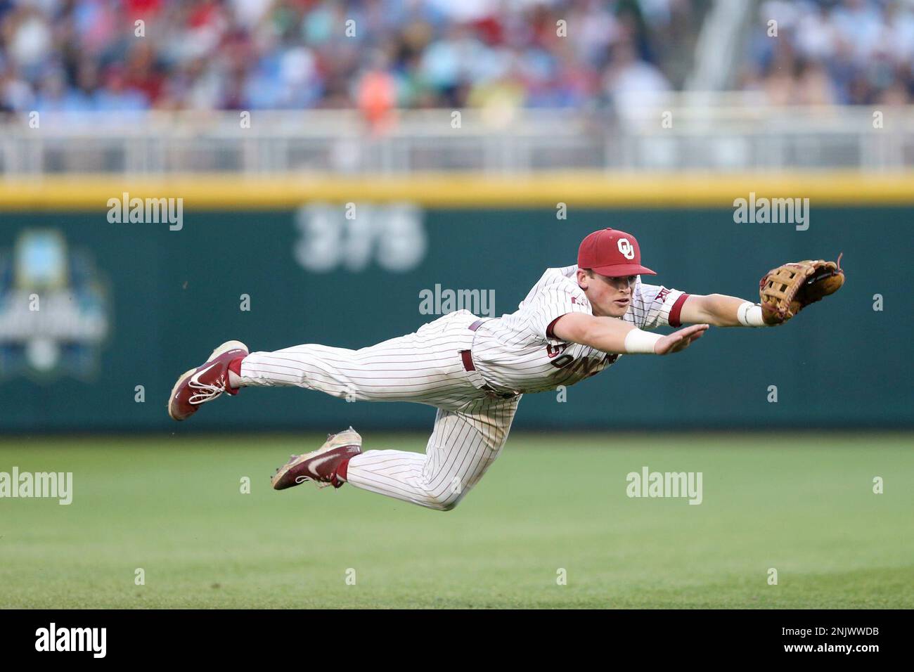 Oklahoma infielder Jackson Nicklaus (15) dives late towards the ball ...