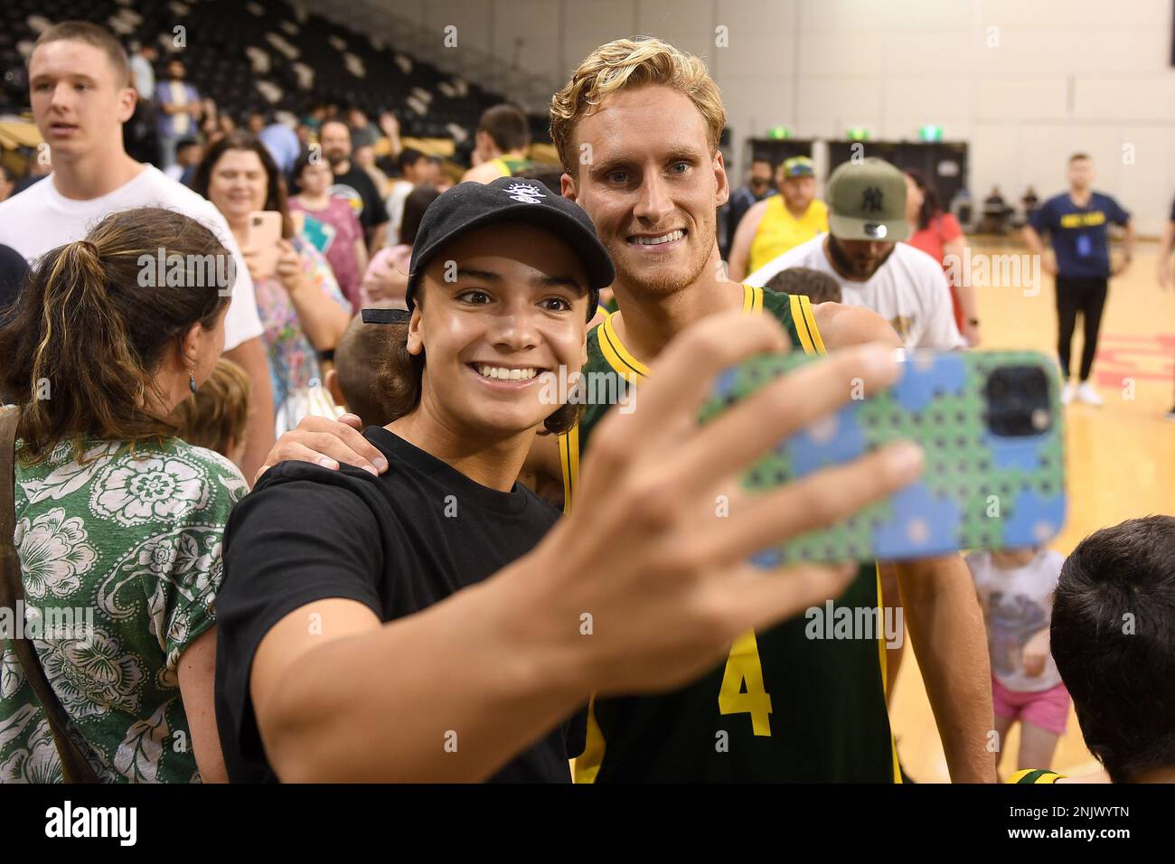 Kyle Adnam of the Boomers poses with a fan following of the 2023 FIBA ...