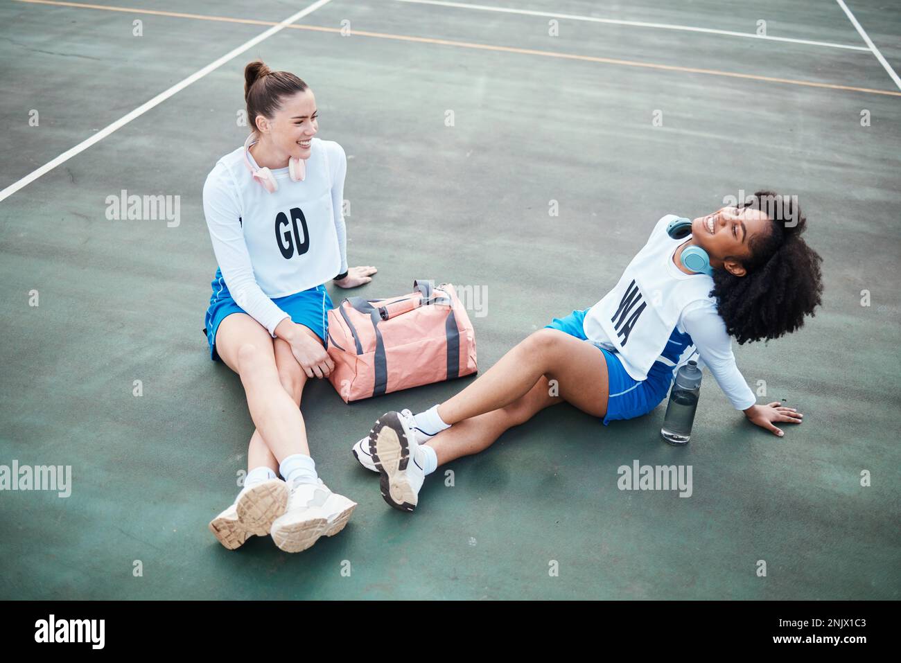 Netball, friends and women talking outdoor after a match, training or ...