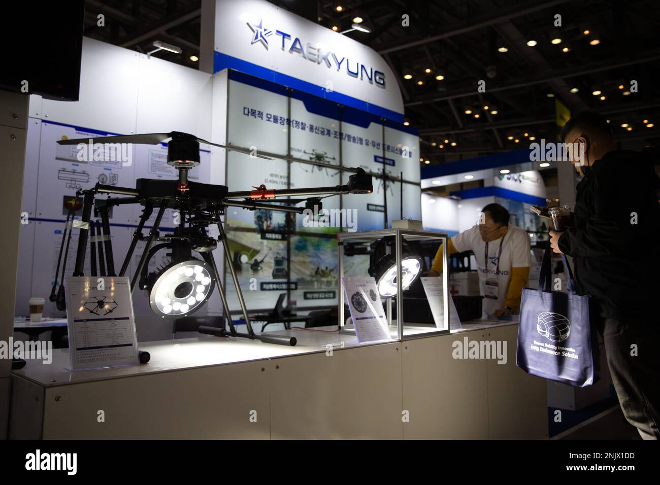 Busan, South Korea. 23rd Feb, 2023. Visitors look at an illuminating ...