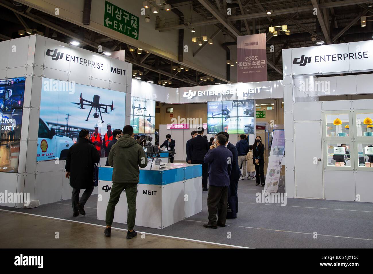 Busan, South Korea. 23rd Feb, 2023. Visitors look at exhibits displayed ...