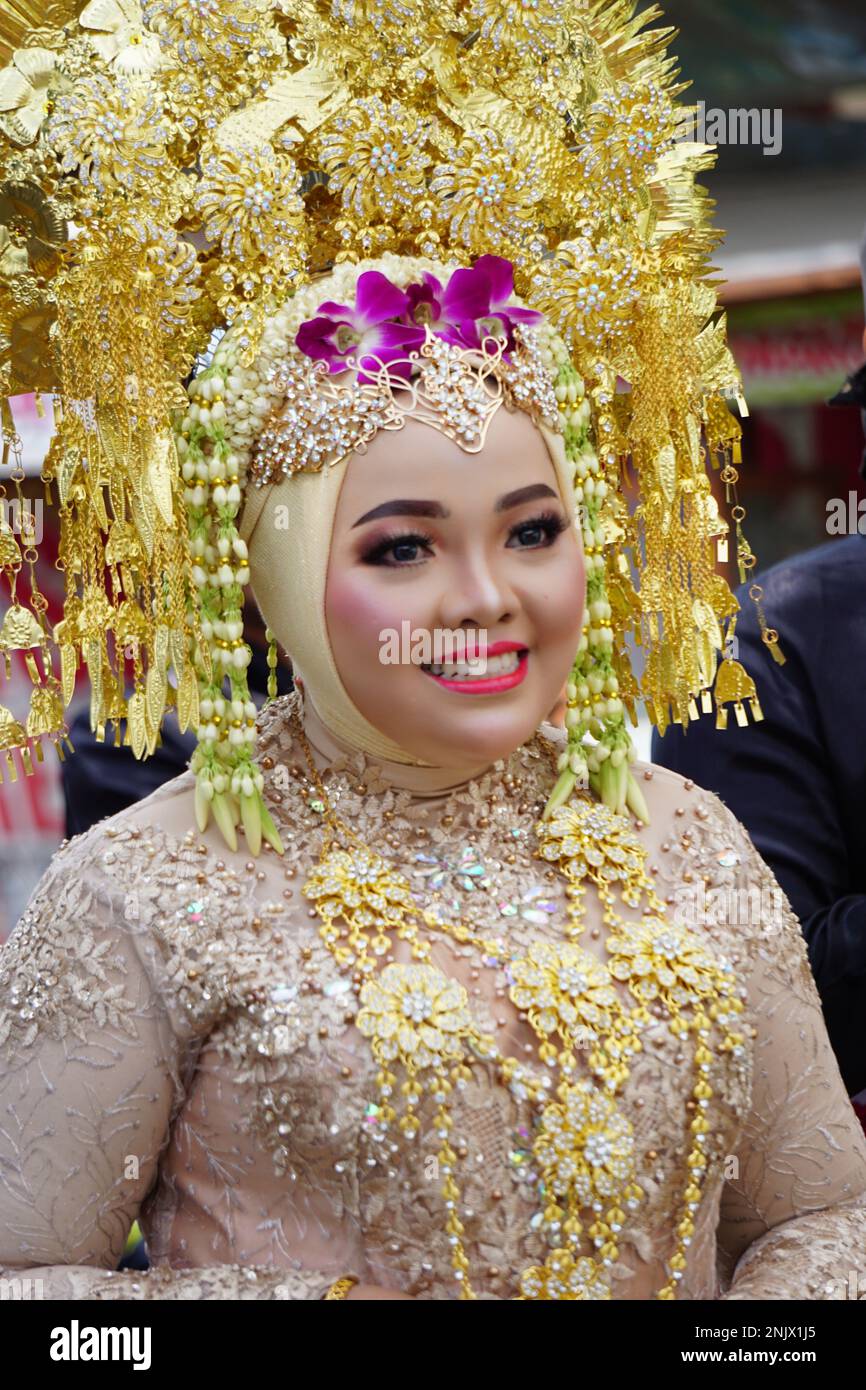Indonesian with a traditional Minangkabau clothes on 1800 chocolate ...