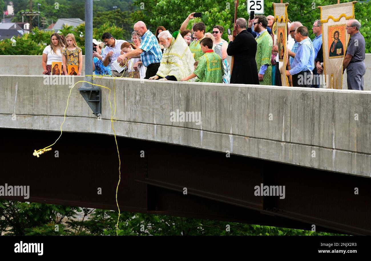 The Very Rev. Archpriest Father George Johnson, center, of Saint John ...