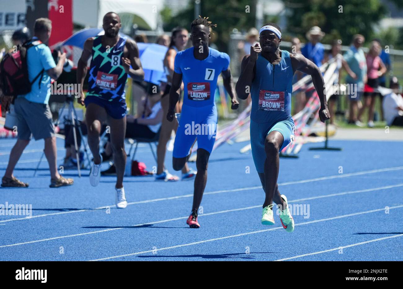 Aaron Brown, right, races to a first-place finish in the men's 200 ...