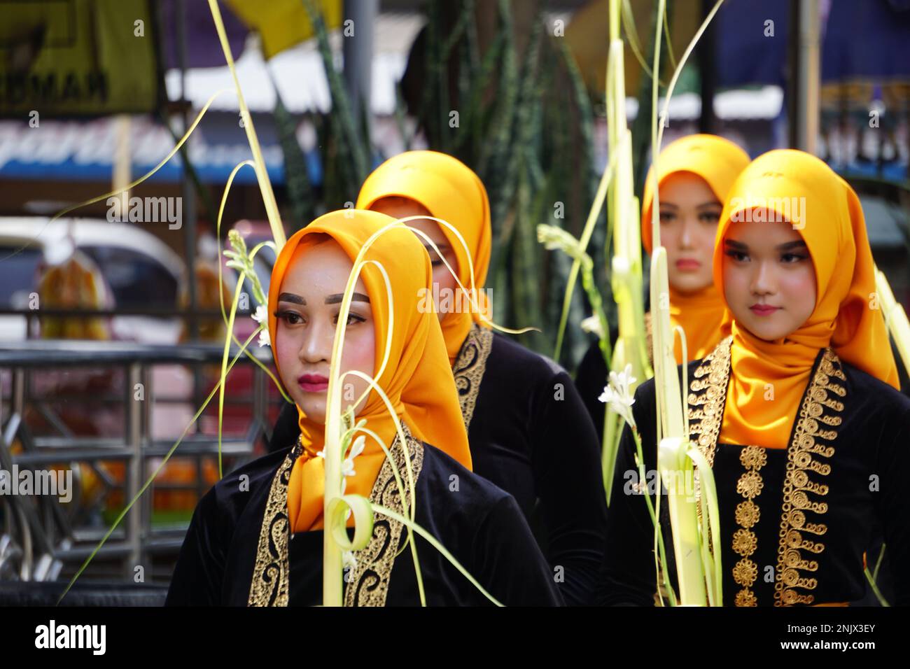 Indonesian with a traditional javanese cloth on 1800 chocolate ketupat ...