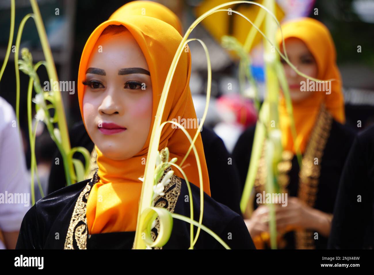Indonesian with a traditional javanese cloth on 1800 chocolate ketupat cultural carnival ...
