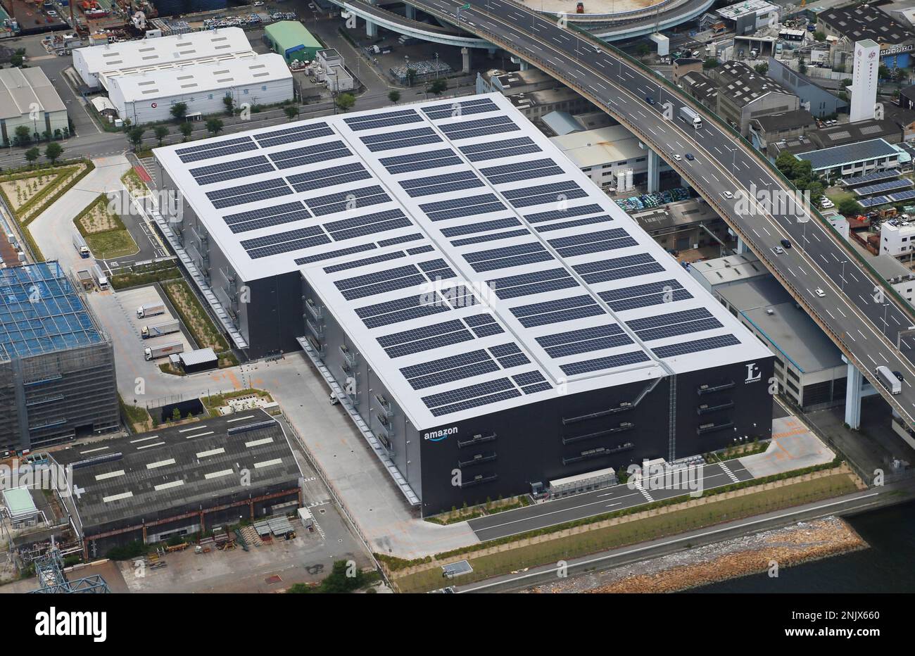 An aerial photo shows a new logistics base of Amazon in Amagasaki City ...