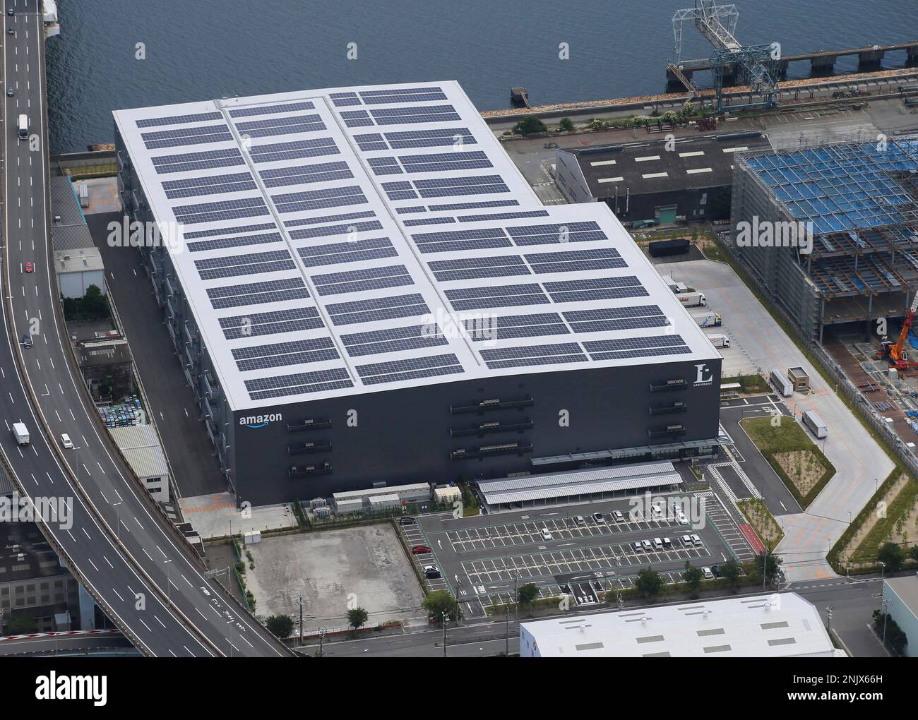 An aerial photo shows a new logistics base of Amazon in Amagasaki City ...