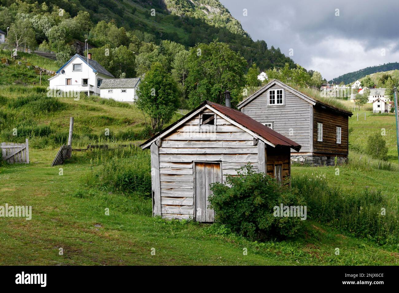 Elderly wooden buildings on a hillside. Outdoor museum in the sunshine ...