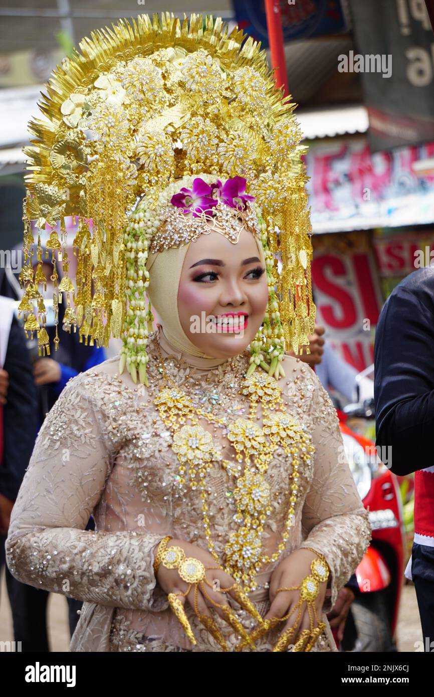 Indonesian with a traditional Minangkabau clothes on 1800 chocolate ...